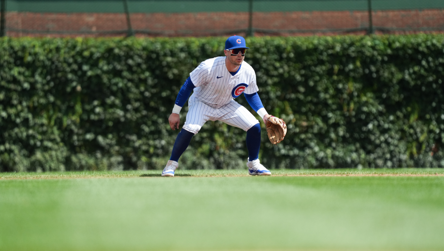 Nico Hoerner Ready Position With Wrigley Ivy In Background | Marquee ...
